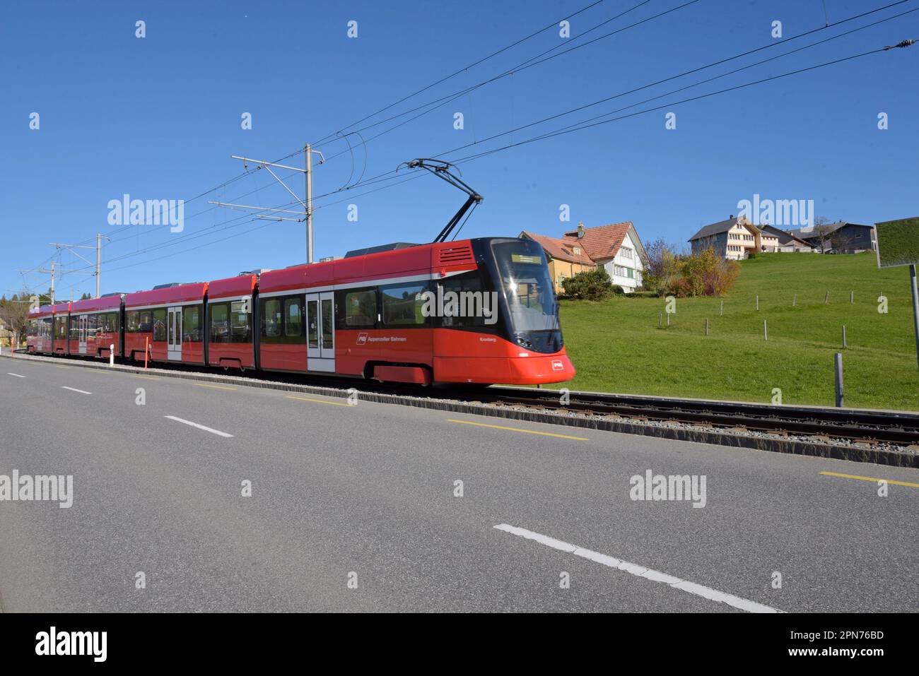 A tram running along the road to St Gallen on the Appenzell -St Gallen ...