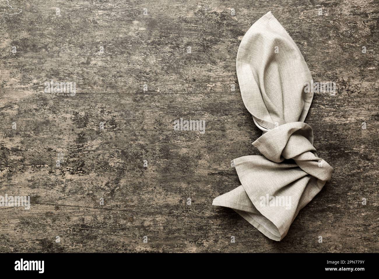 top view with gray kitchen napkin isolated on table background. Folded ...