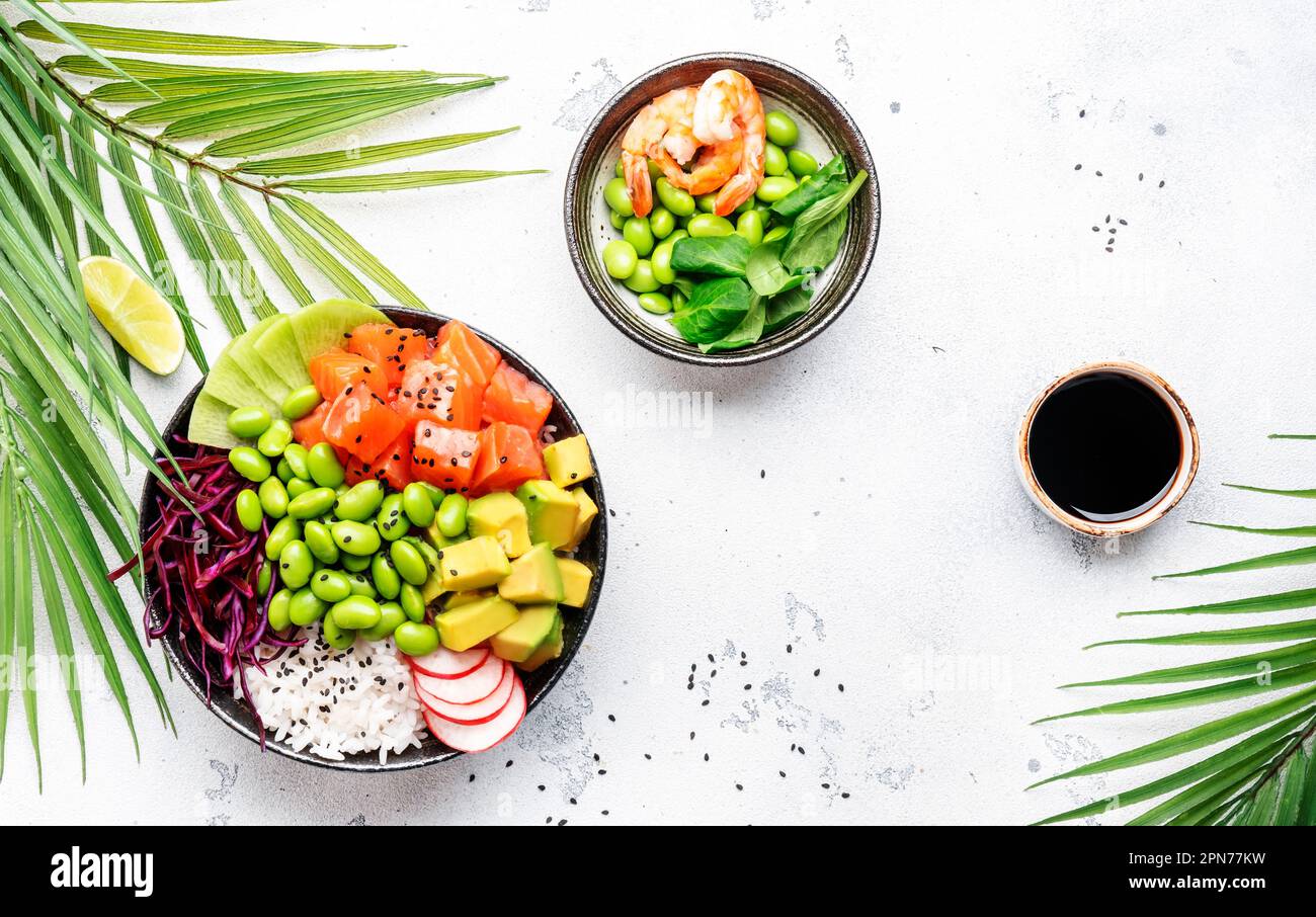 Poke bowl with salted salmon, avocado, radish, edamame beans, cabbage ...