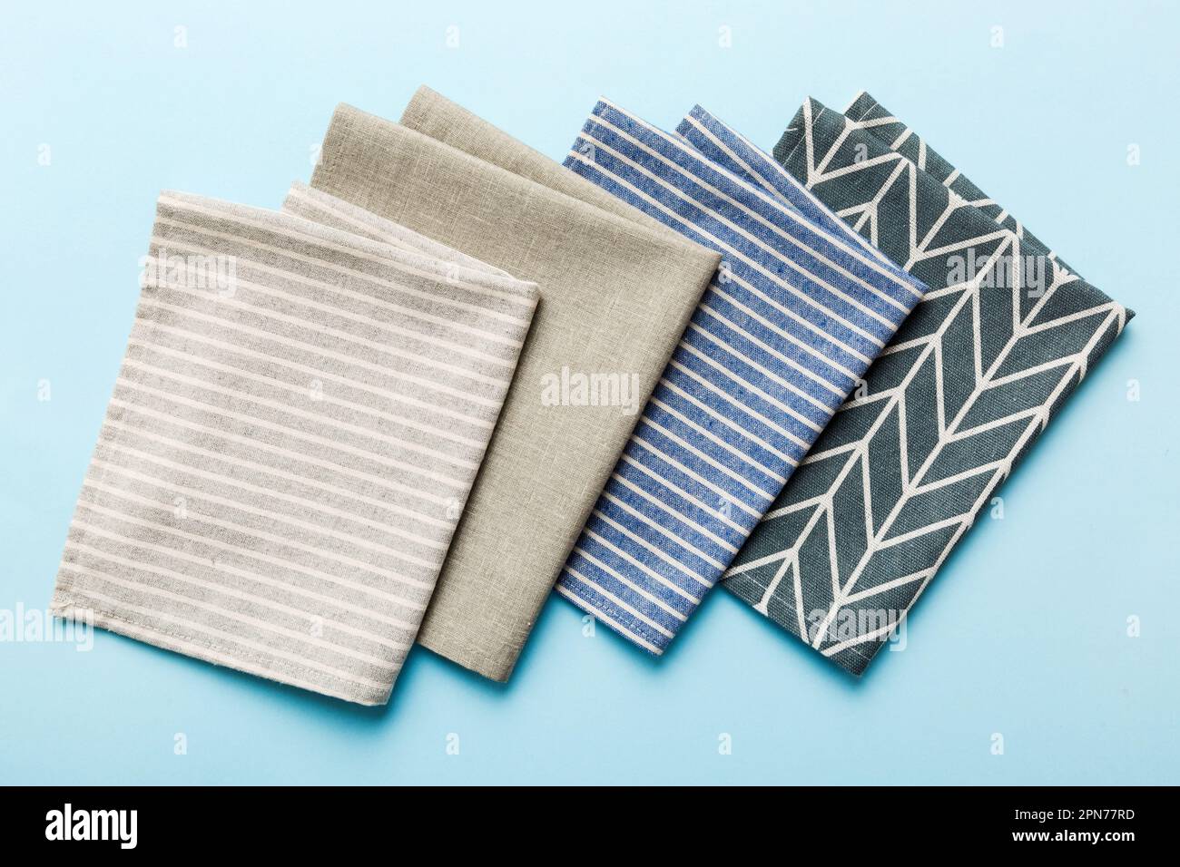 top view with gray kitchen napkin isolated on table background. Folded ...