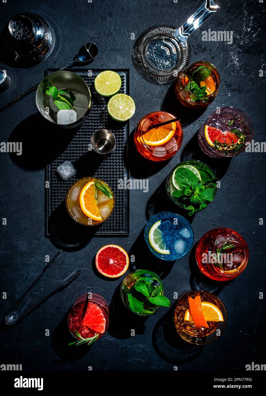 Cocktails set on black bar counter, top view. Mixology concept ...
