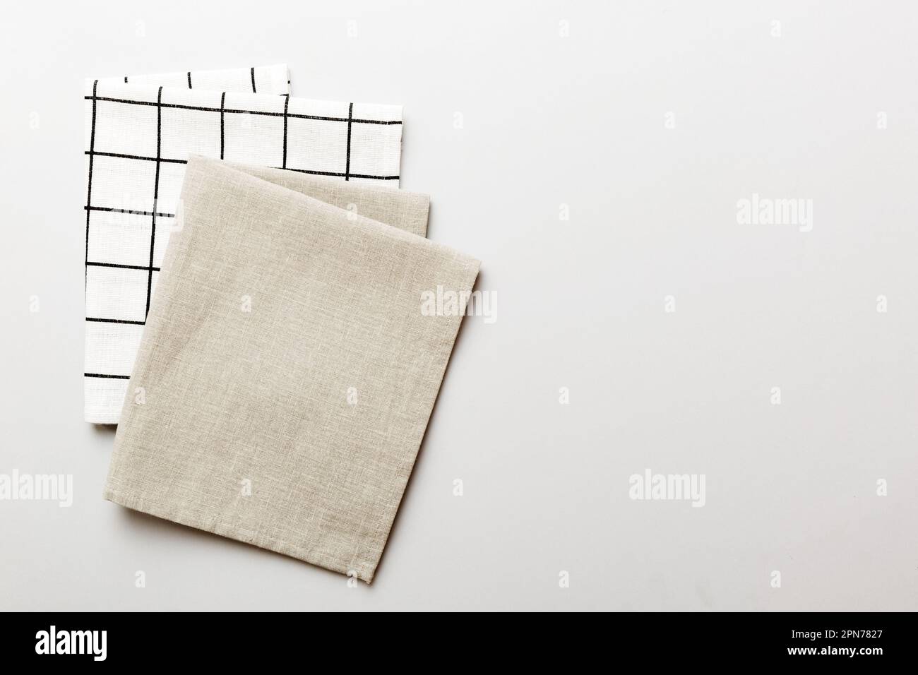 top view with gray kitchen napkin isolated on table background. Folded ...