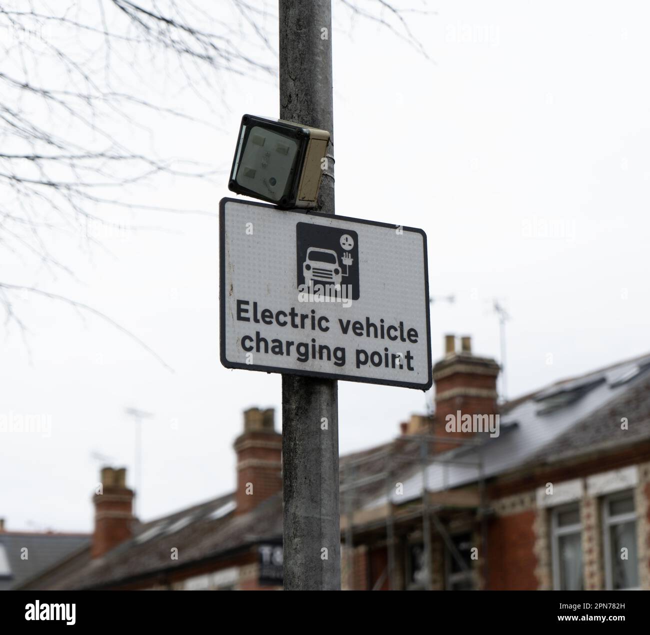 Sign informing drivers of an on-street electric vehicle charging point ...