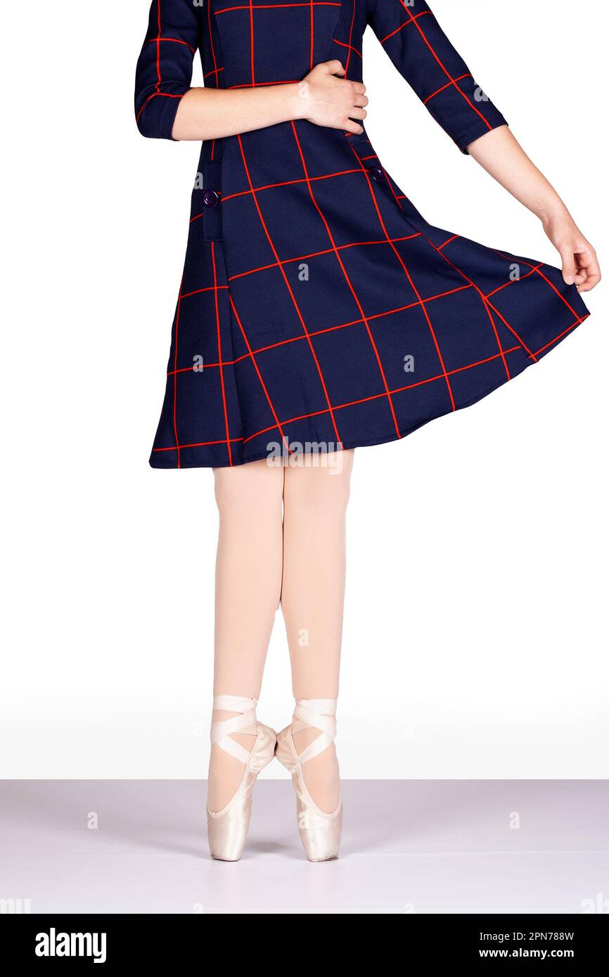 En Pointe CORRECT heels together hand on waist and holding blue tartan ...