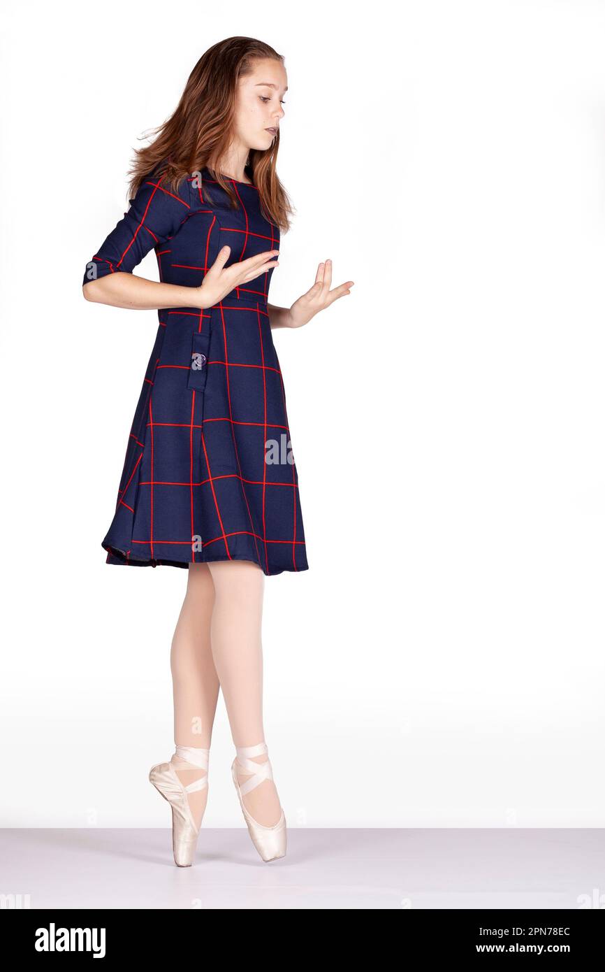 En Pointe mid step walking right, hands in fancy first position ...