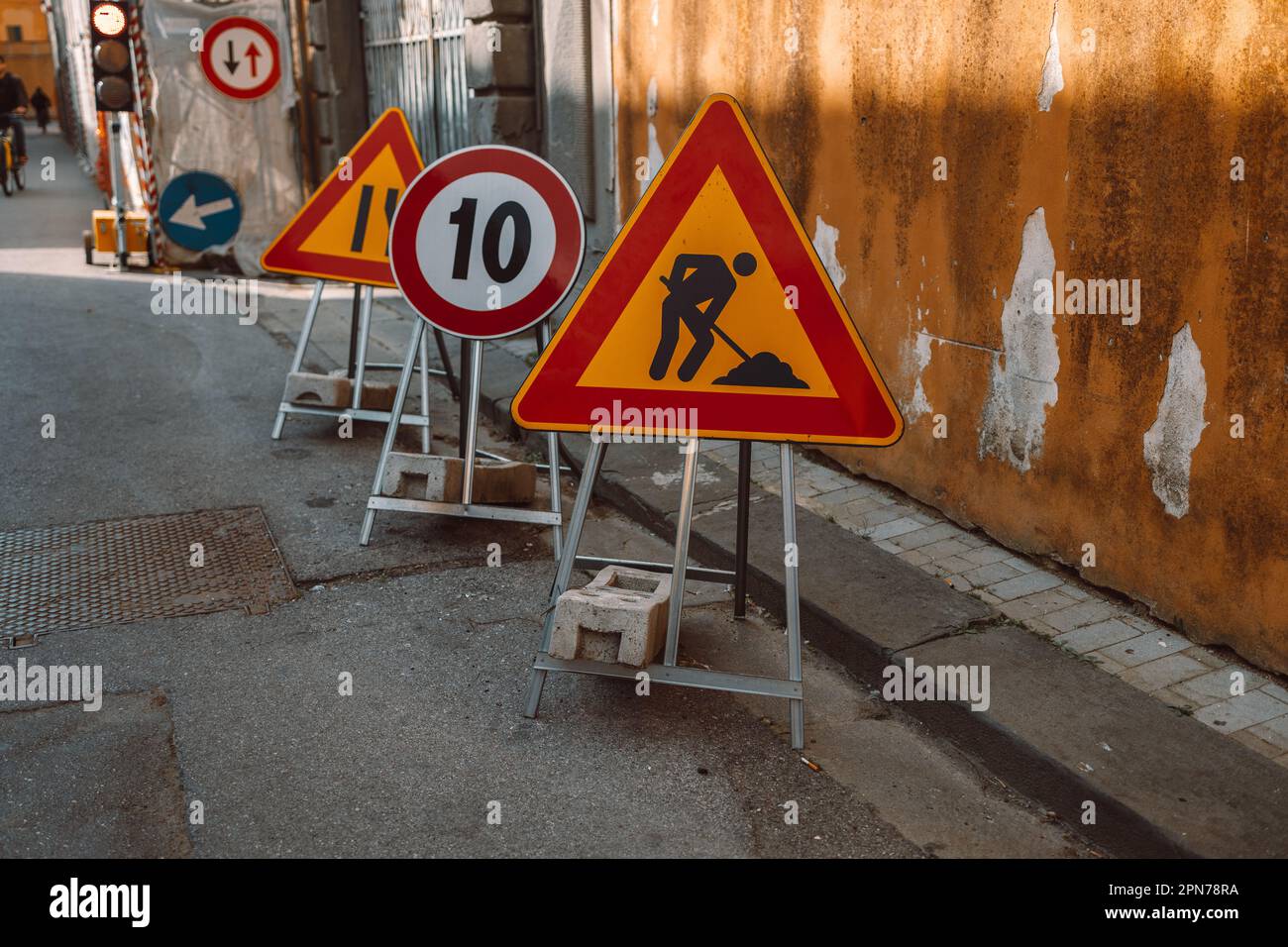 Road works sign on the road. Repair work of road signs and a bypass ...