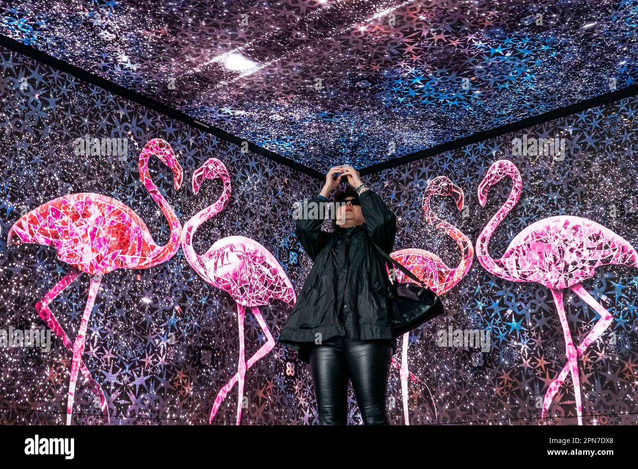 A person takes a photo of The Spaces In-Between installation by visual ...