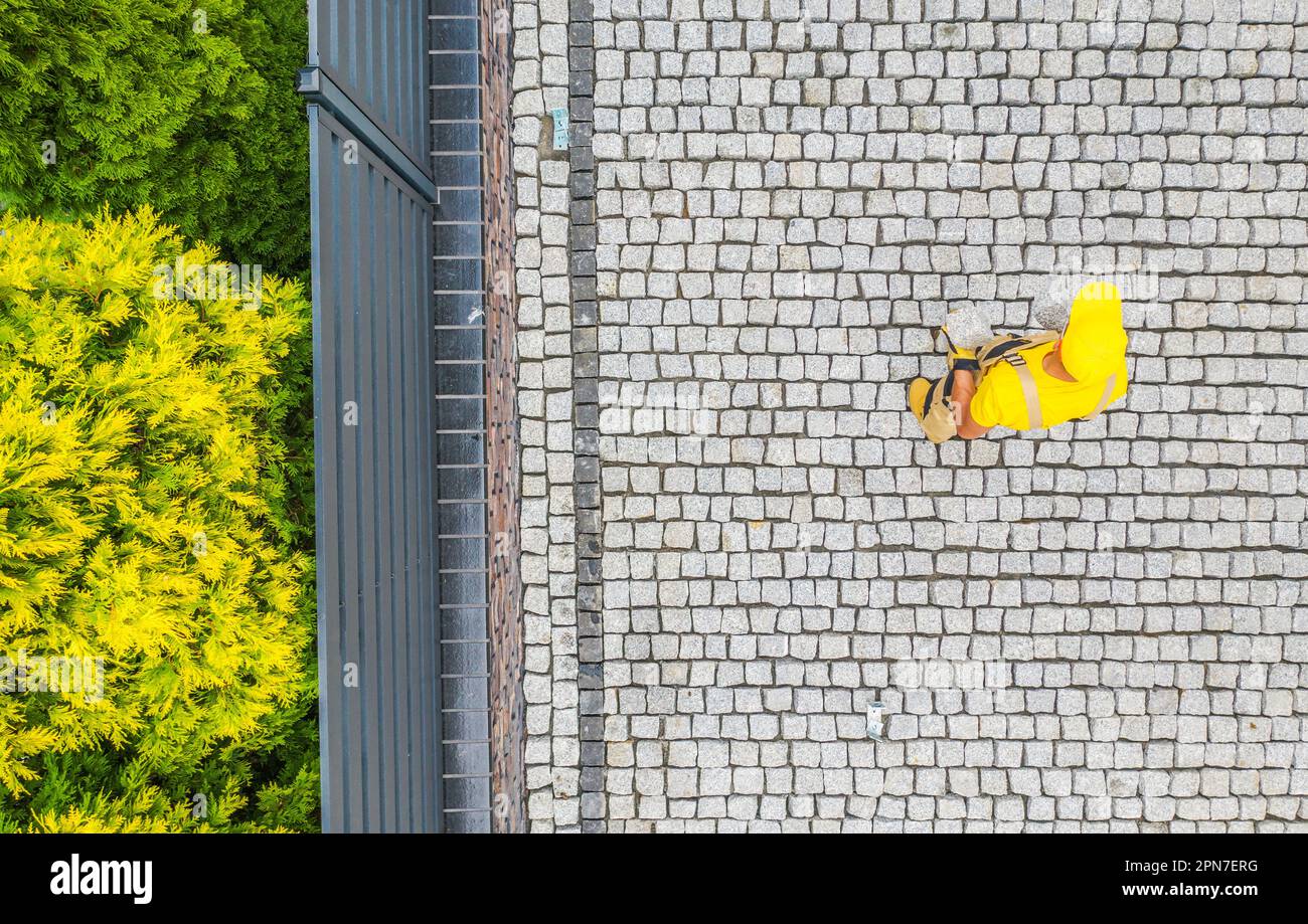 Aerial View of Construction Worker in Yellow Working Suit Finishing ...