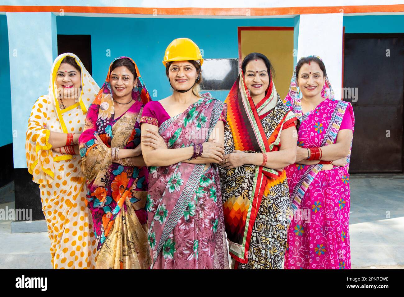 Group of confident young indian women wearing sari standing with female ...