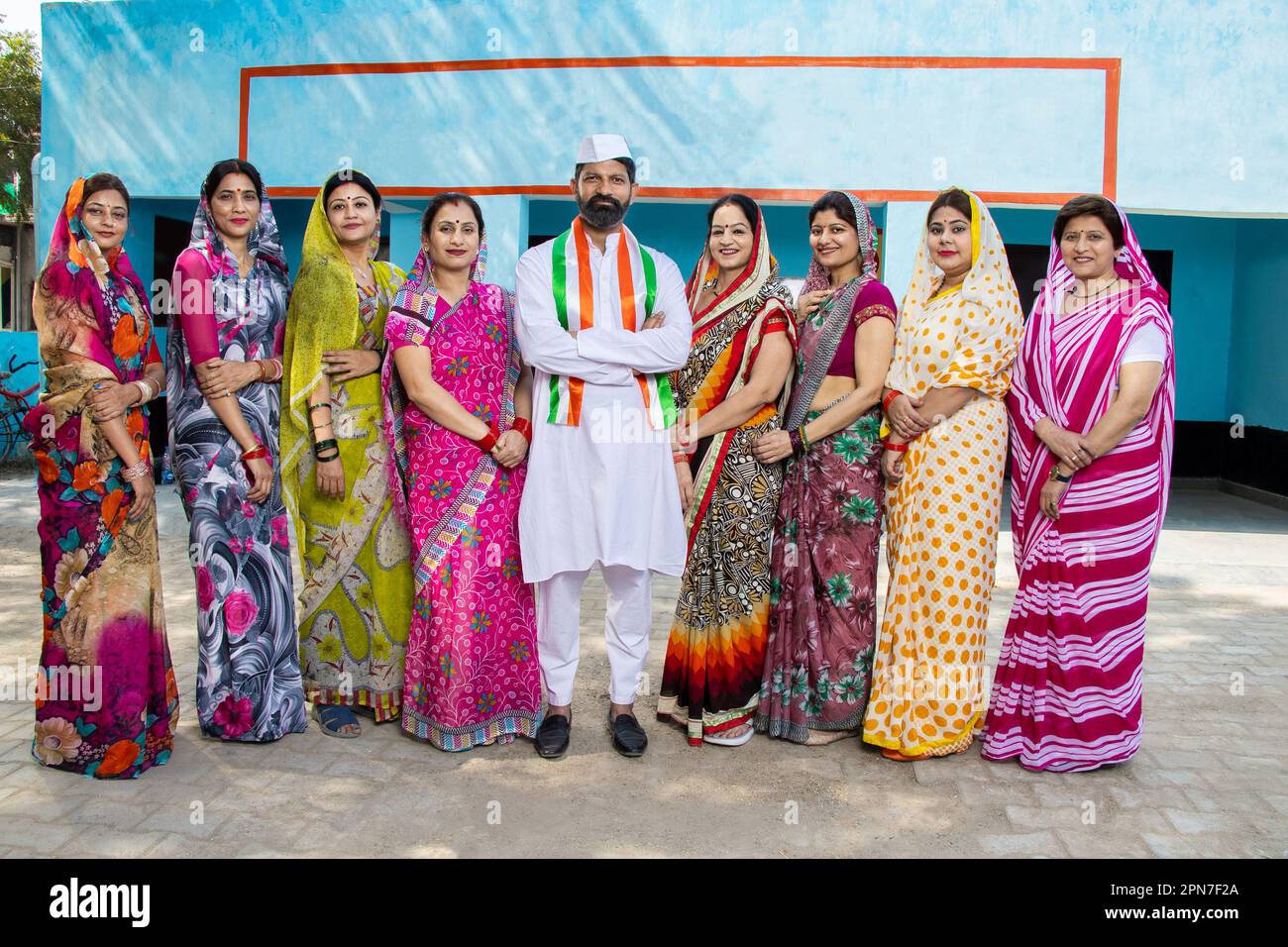 Indian man politician standing cross arms with group of traditional ...
