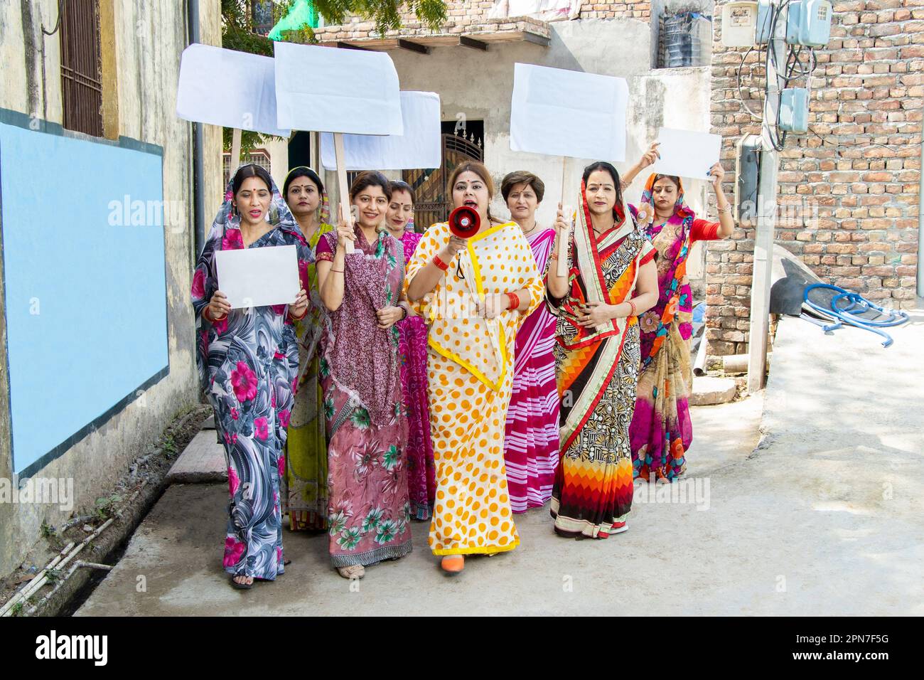 Group Of Traditional Indian Woman Holding Blank Cardboard Placard