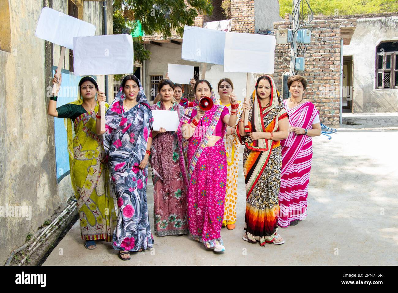 Group of traditional indian woman holding blank cardboard placard ...