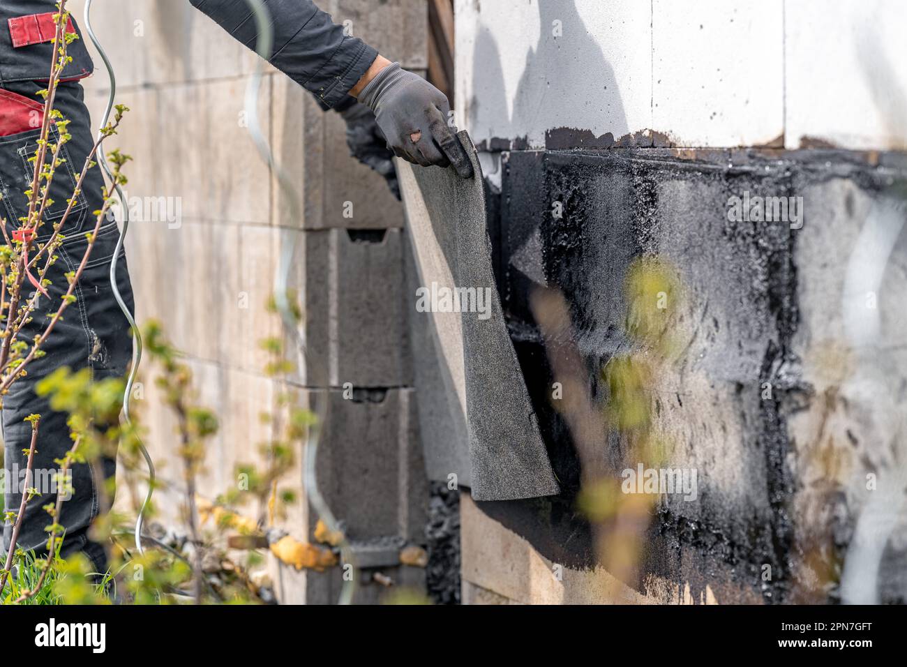 installation of protective waterproofing on the foundation and walls of ...