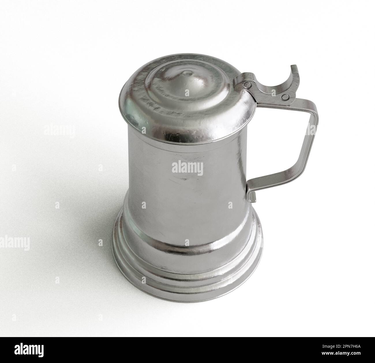 A vintage silver drinking tankard with a lid on an isolated white ...