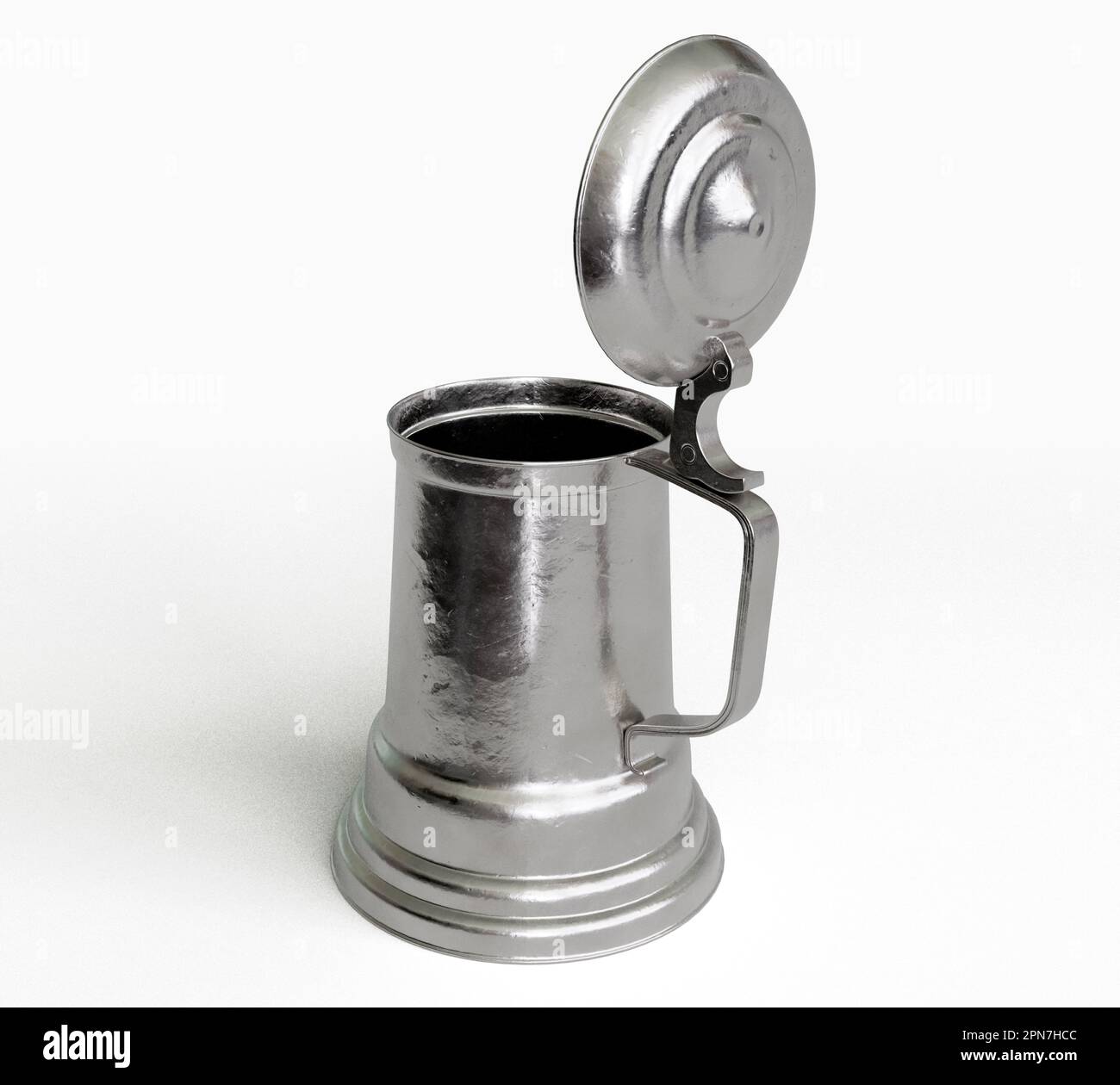 A vintage silver drinking tankard with a lid on an isolated white ...