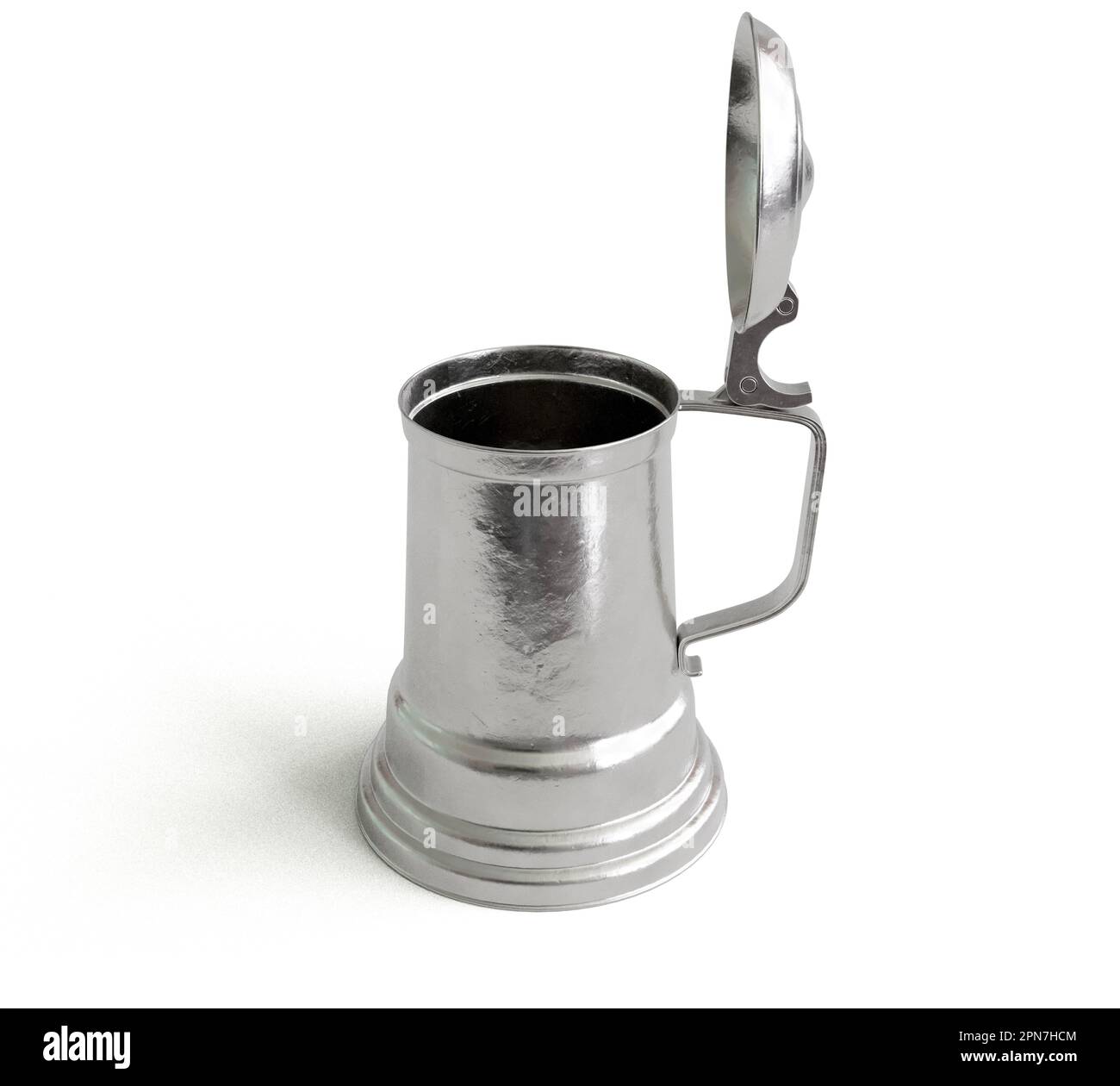 A vintage silver drinking tankard with a lid on an isolated white ...