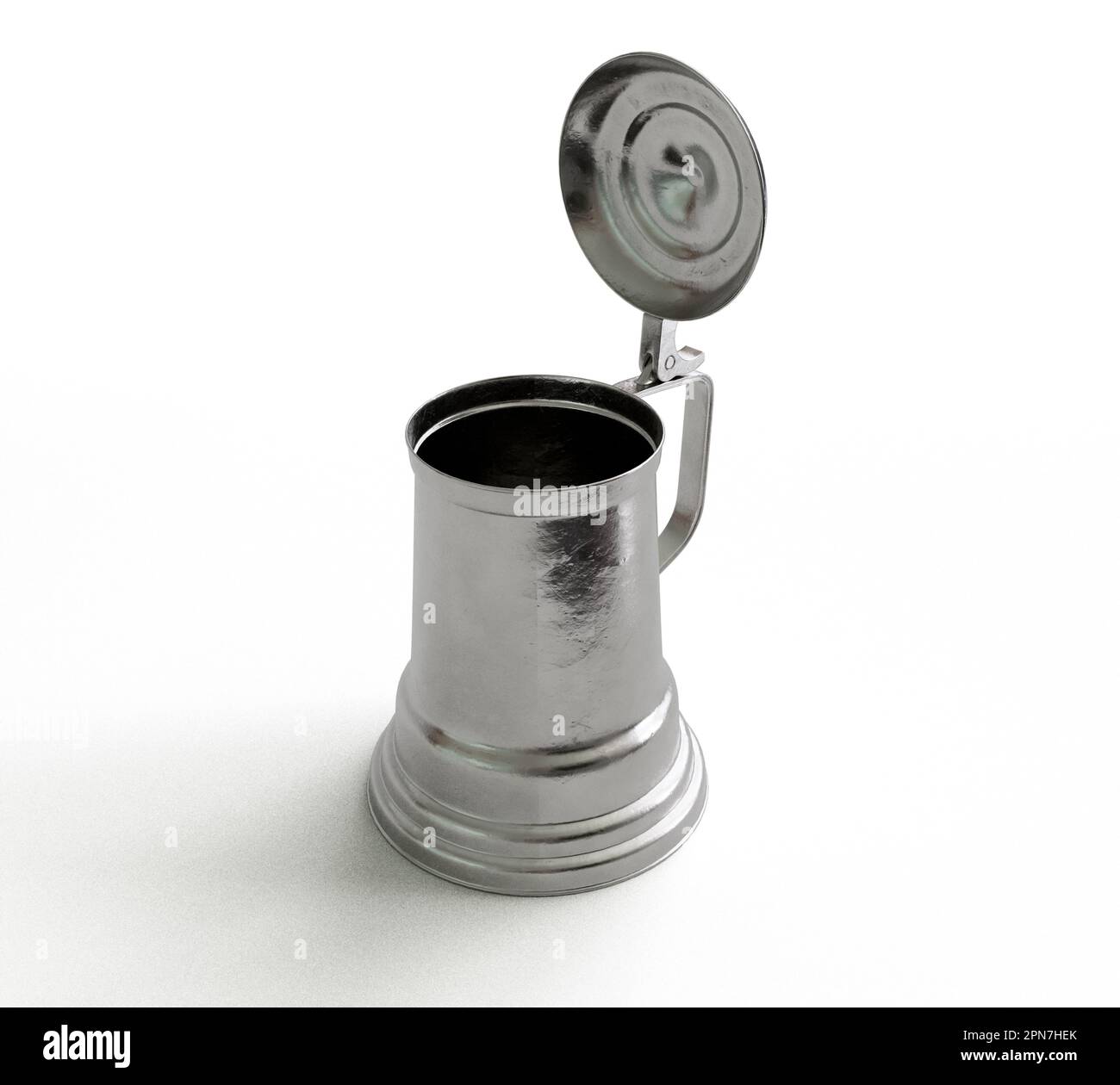 A vintage silver drinking tankard with a lid on an isolated white ...