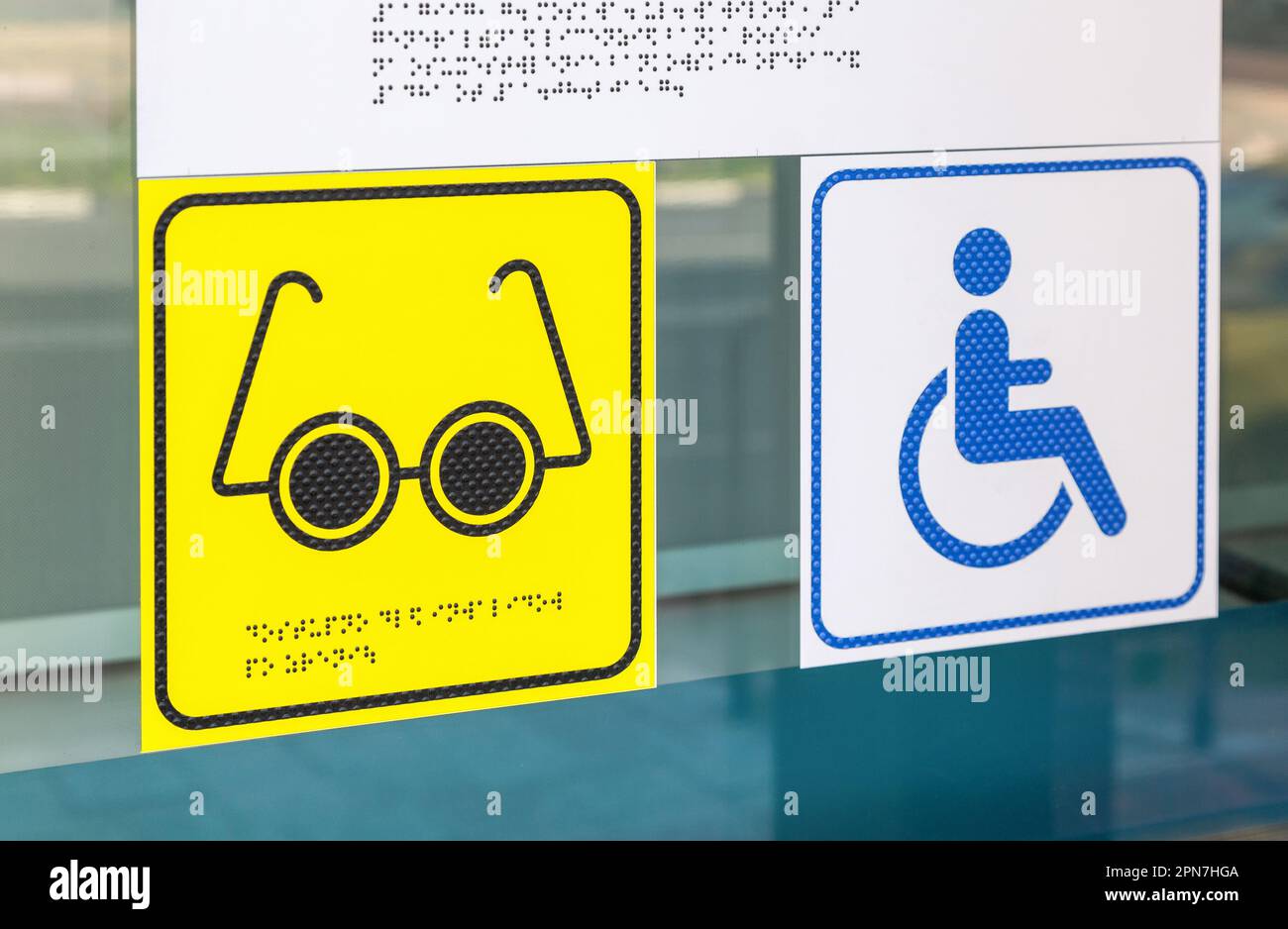 Signage plate for disabled people with braille inscription. Accessible ...