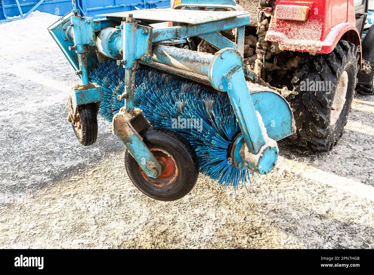 Brushes of street cleaning machine on street in winter. Nylon brush of ...