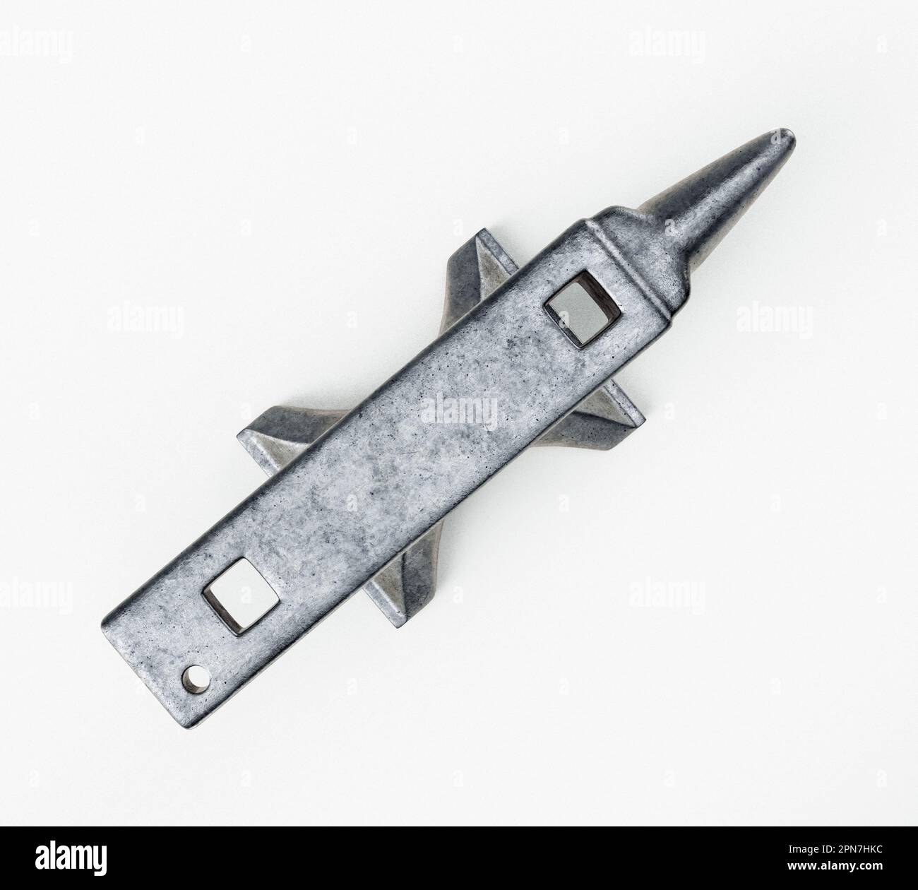 A heavy iron blacksmiths anvil on an isolated white studio background ...