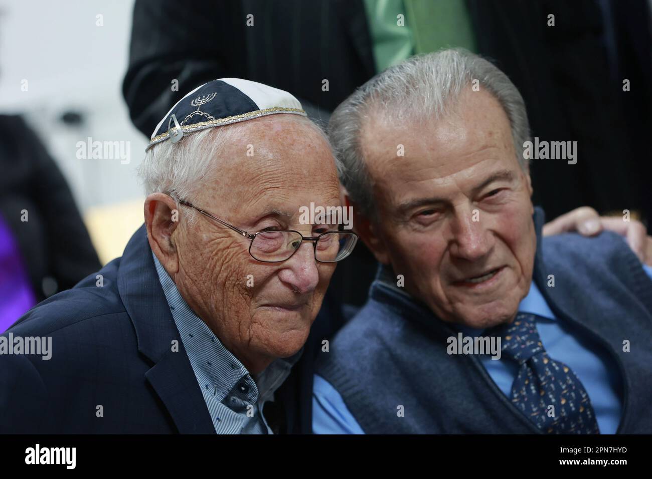 Survivors Jerry Wartski, left, and Albrecht Weinberg sit together during a commemoration ...