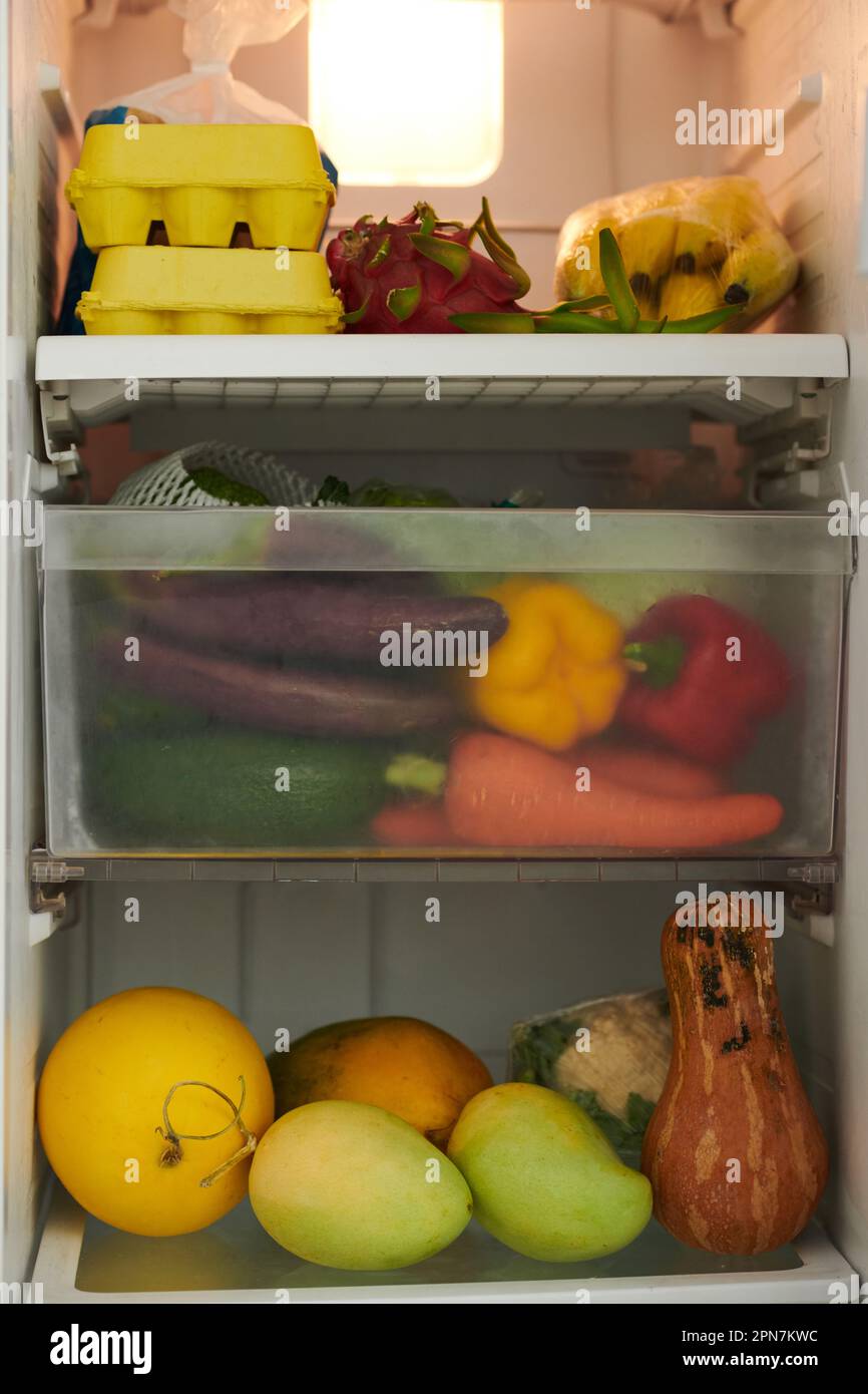 Open fridge with fresh vegetables, fruits and eggs Stock Photo - Alamy