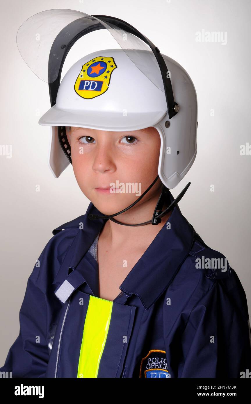 A Young boy wearing a policeman's costume Stock Photo - Alamy