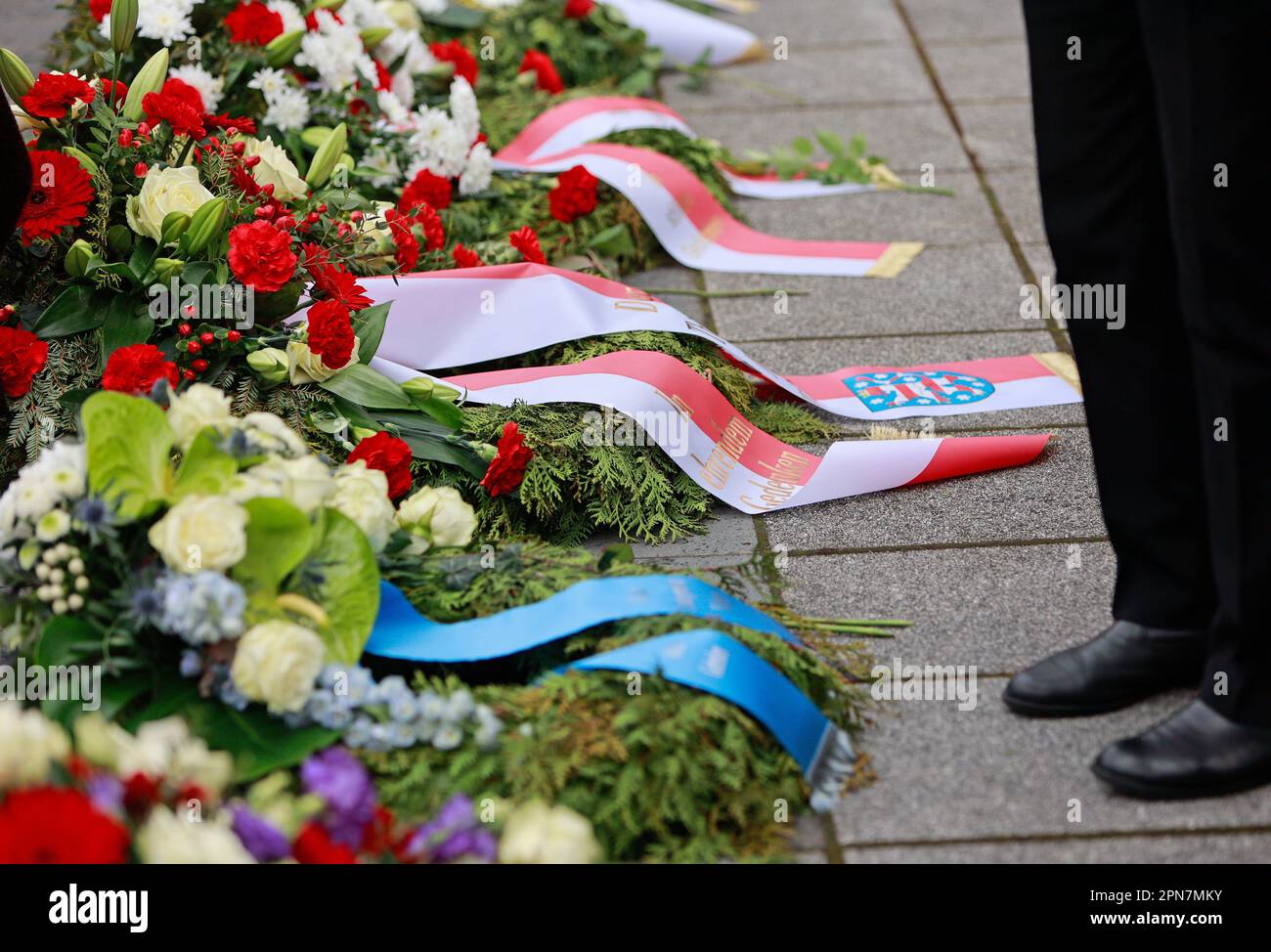 Nordhausen, Germany. 17th Apr, 2023. Wreaths lie at the commemoration ...