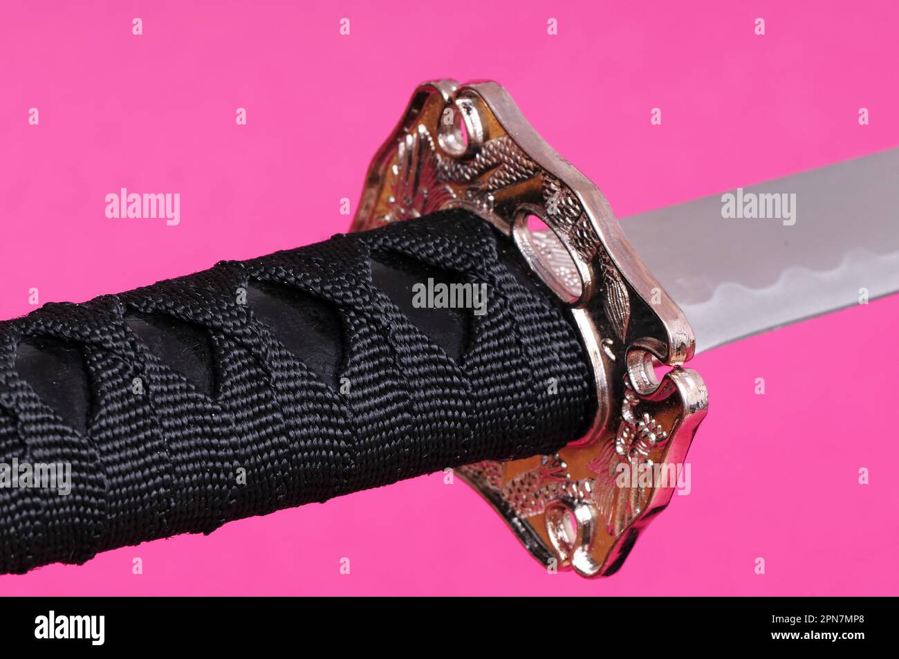Japanese sword blade, guard, and hilt isolated over pink Stock Photo ...