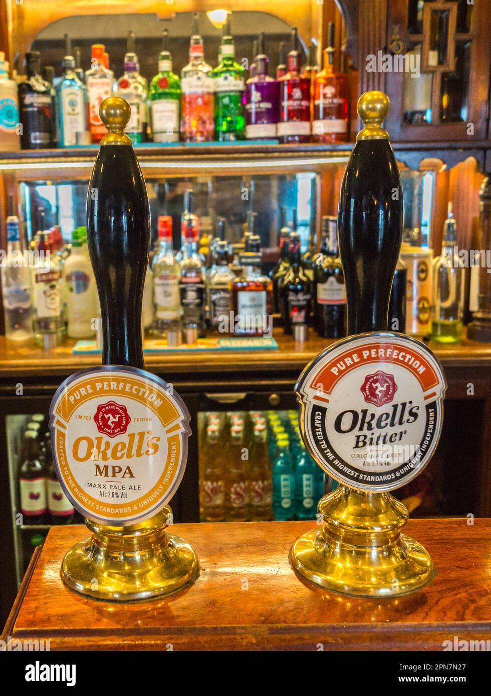 Okell's brewery pump clips on the bar of the Terminus Tavern ...