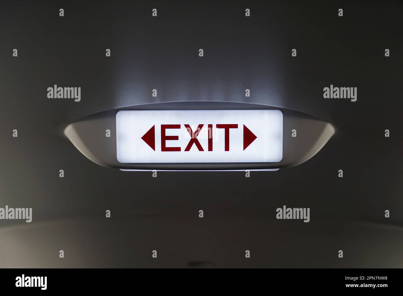 Emergency exit sign inside an airpane Stock Photo - Alamy