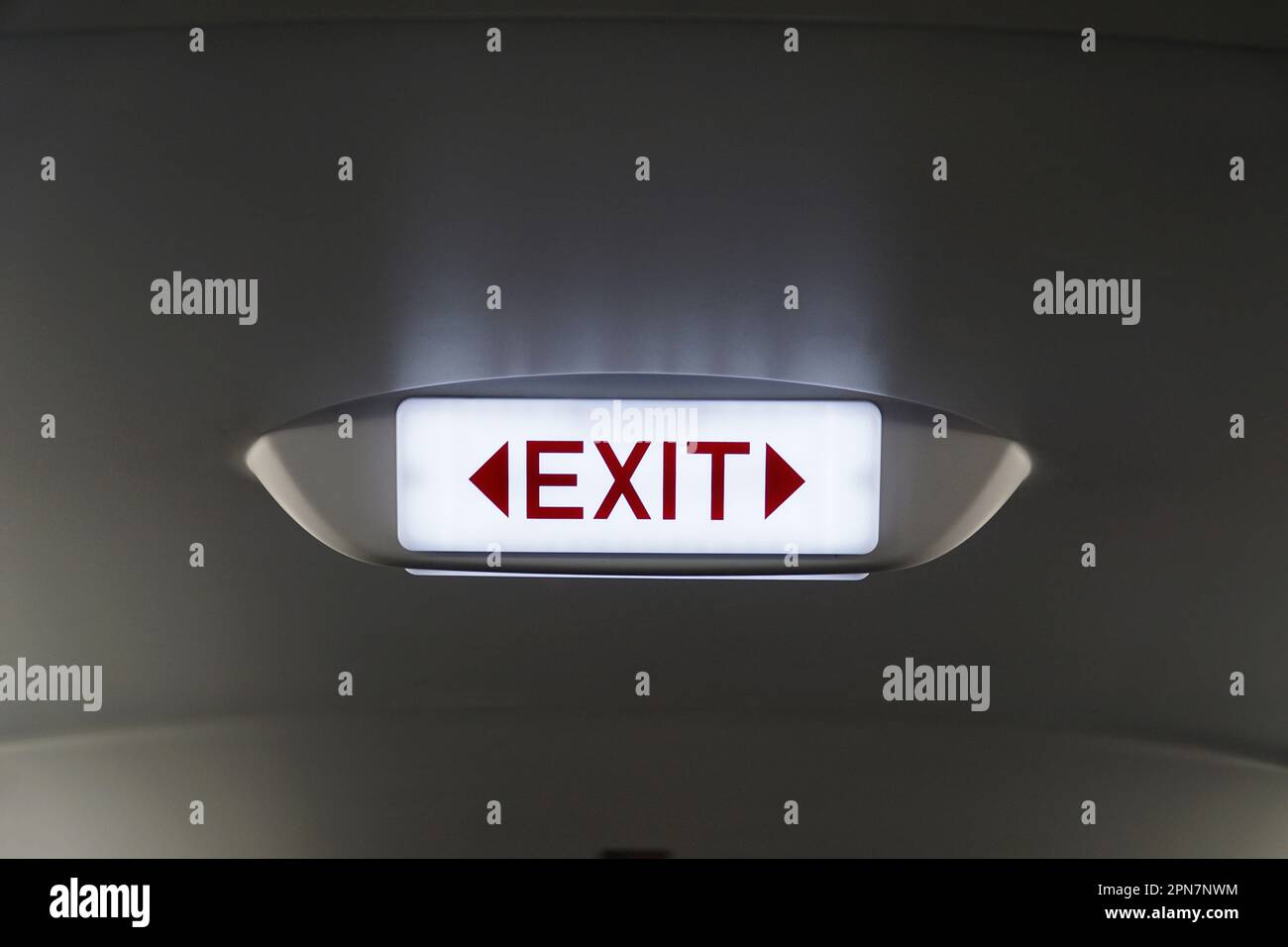 Emergency exit sign inside an airpane Stock Photo - Alamy