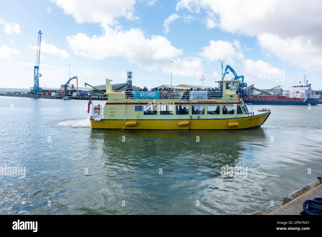 A yellow tour boat departs form Poole Harbour in Dorset, UK Stock Photo ...