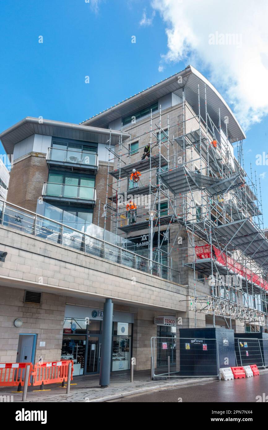 Scaffolding on the side of an apartment block under construction at ...