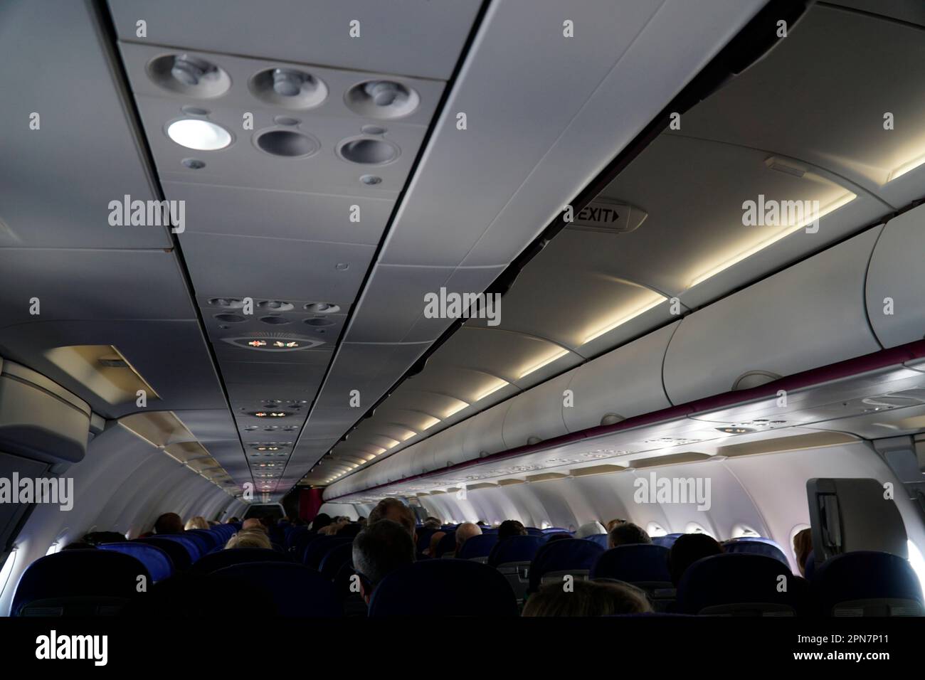 Flying inside passenger airplane - flight concept Stock Photo - Alamy
