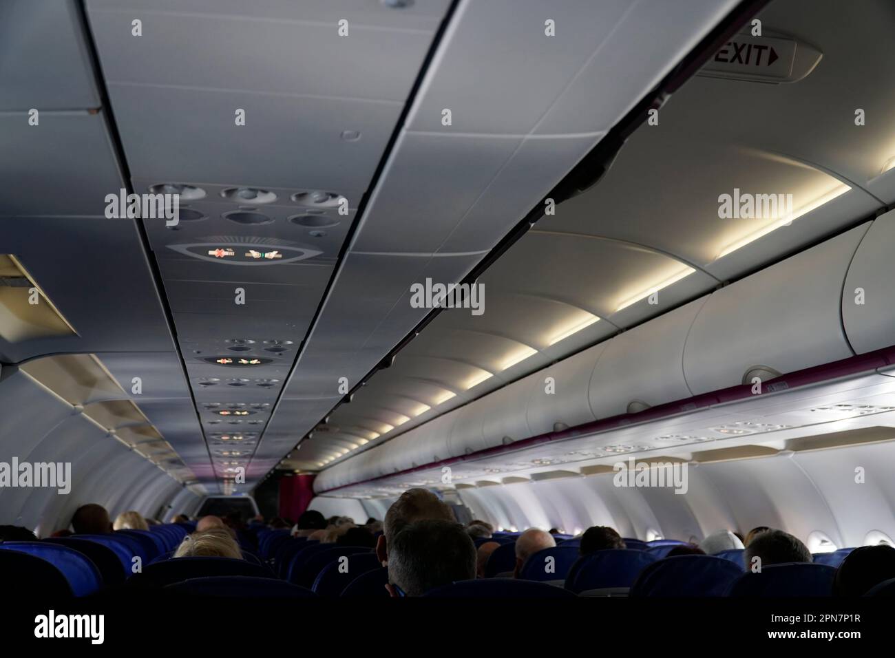Flying inside passenger airplane - flight concept Stock Photo - Alamy