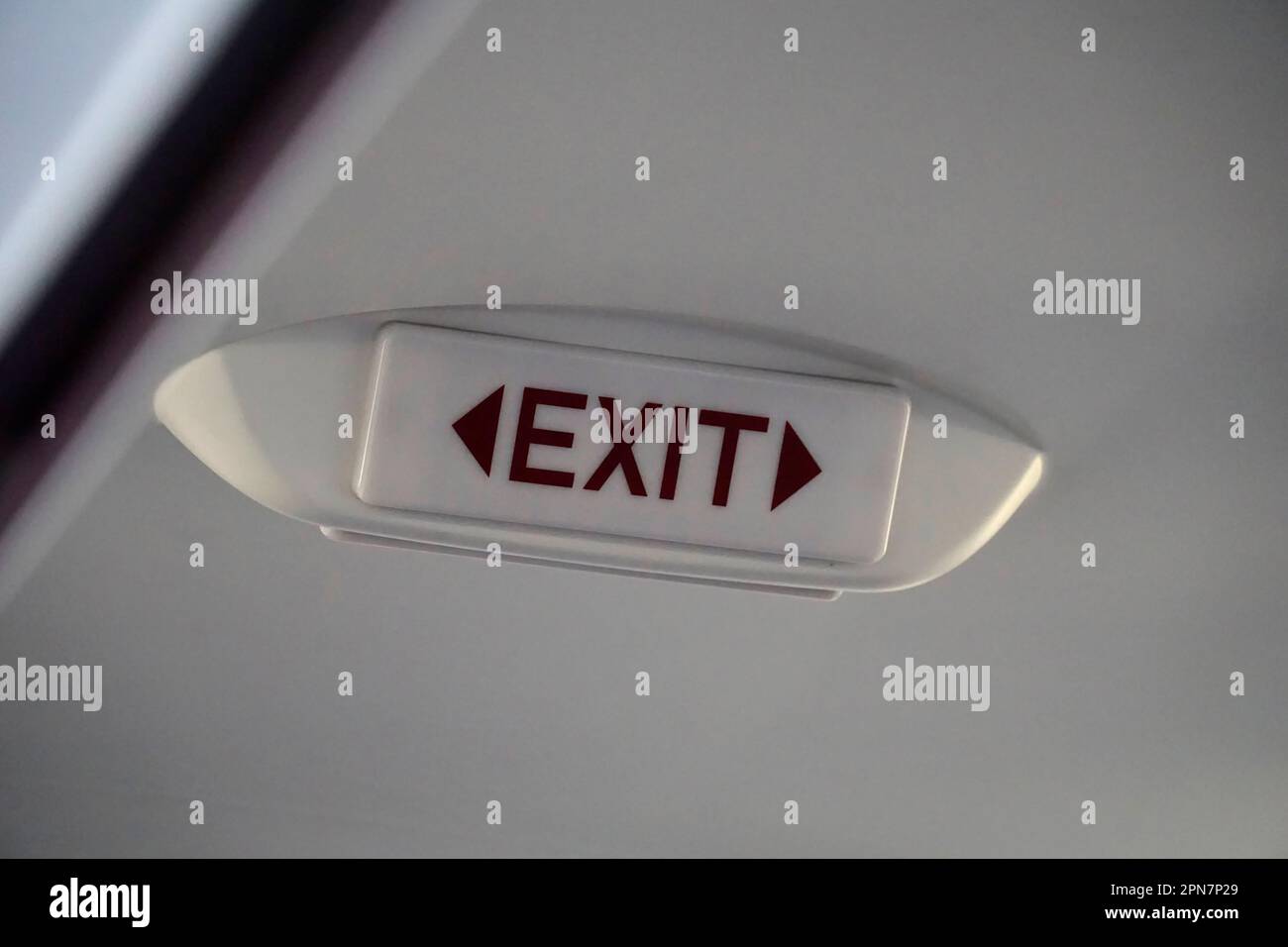 Emergency exit sign inside an airpane Stock Photo - Alamy