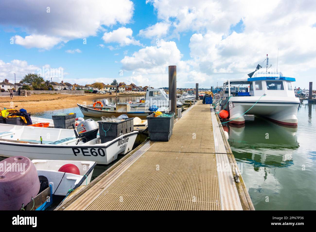 Boats moored on a pontoon in Poole Harbour in Dorset, UK Stock Photo ...