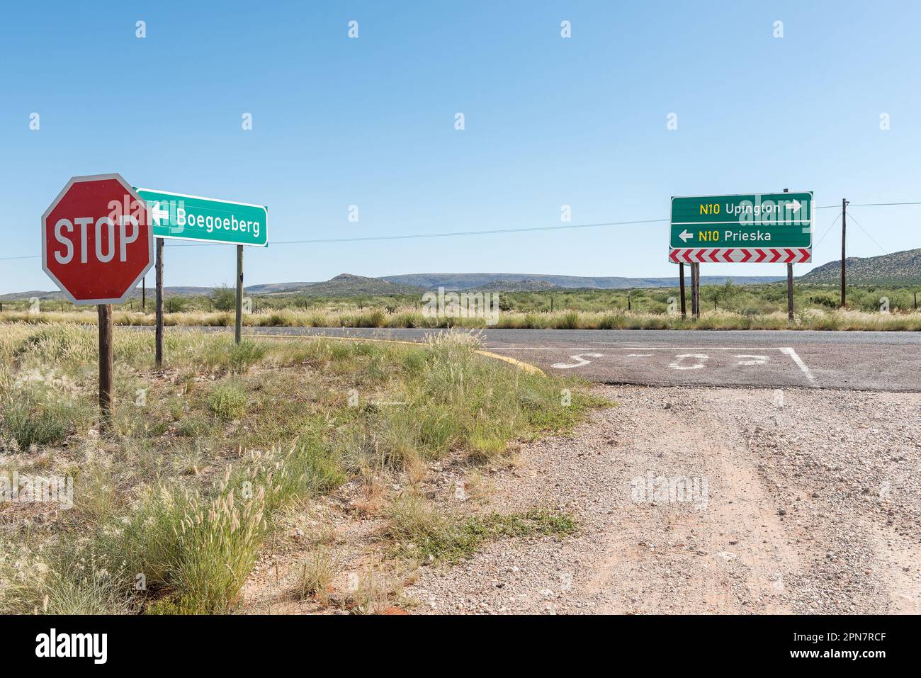 A directional sign and a stop sign at the junction of the Boegoeberg ...