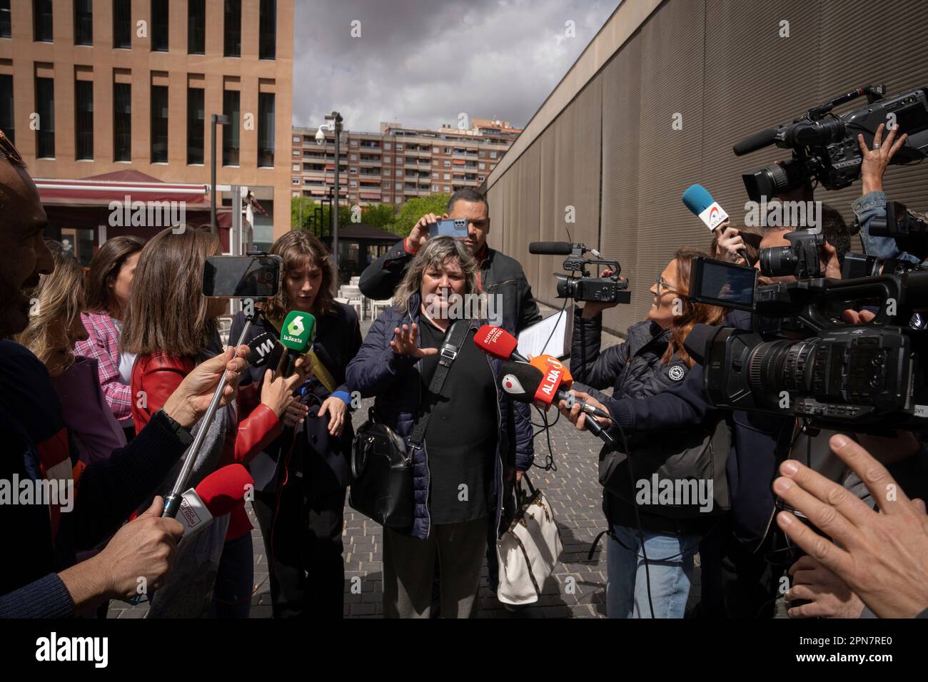 The victim's lawyer Ester Garcia gives statements to the media as she ...