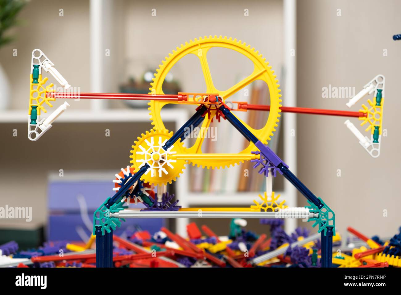 Children's constructor of gears cogwheel and sticks in the children's ...