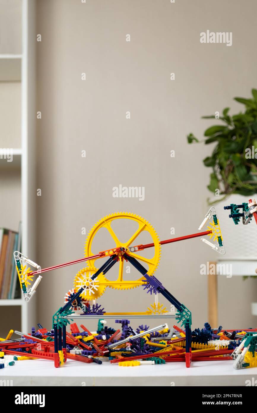Children's constructor of gears cogwheel and sticks in the children's ...