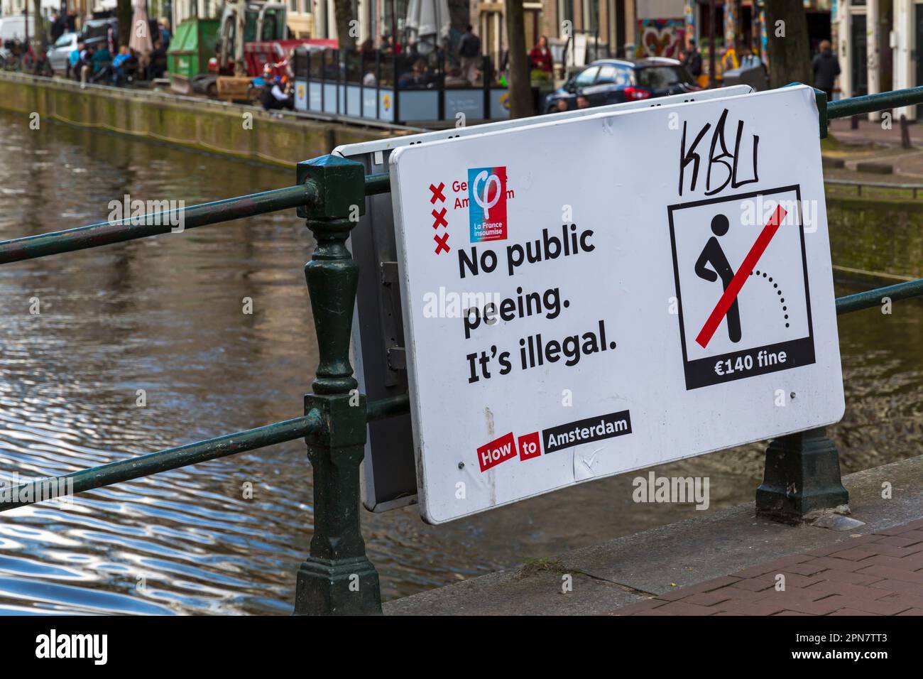 No public peeing It's illegal sign on bridge over canal at Amsterdam ...