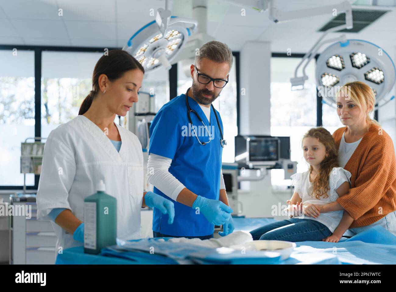 Little girl with her mother in surgery examination Stock Photo - Alamy
