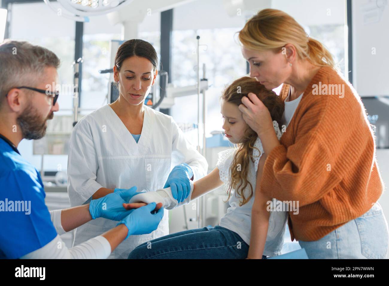 Little girl with her mother in surgery examination Stock Photo - Alamy