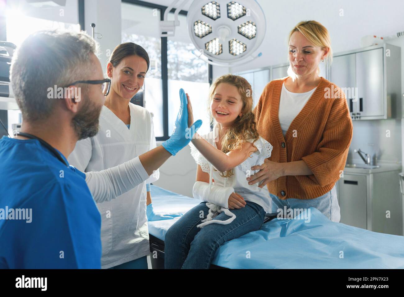 Little girl with her mother in surgery examination Stock Photo - Alamy