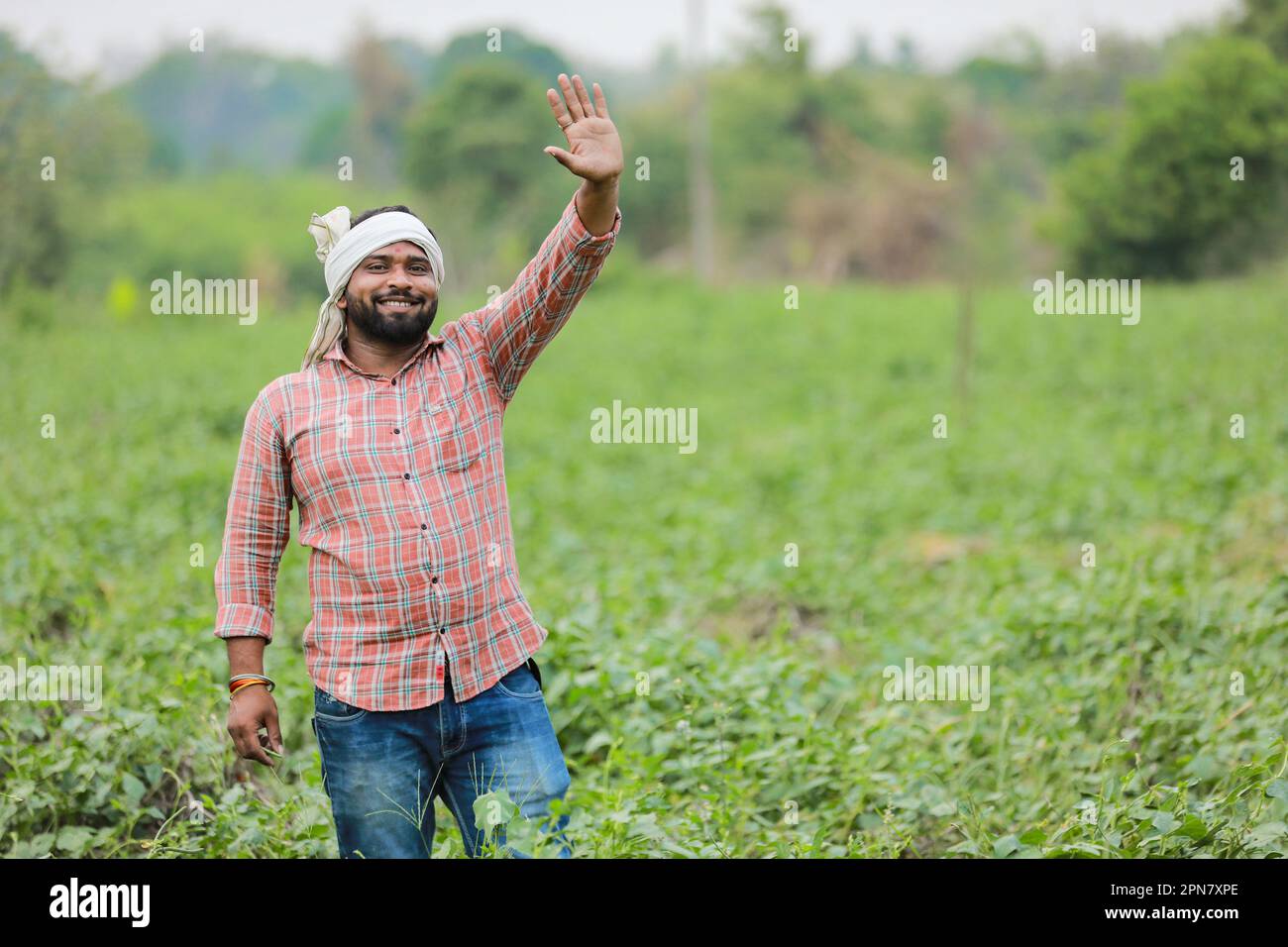 Happy Indian farmer, young farmer smiling in farm Stock Photo - Alamy