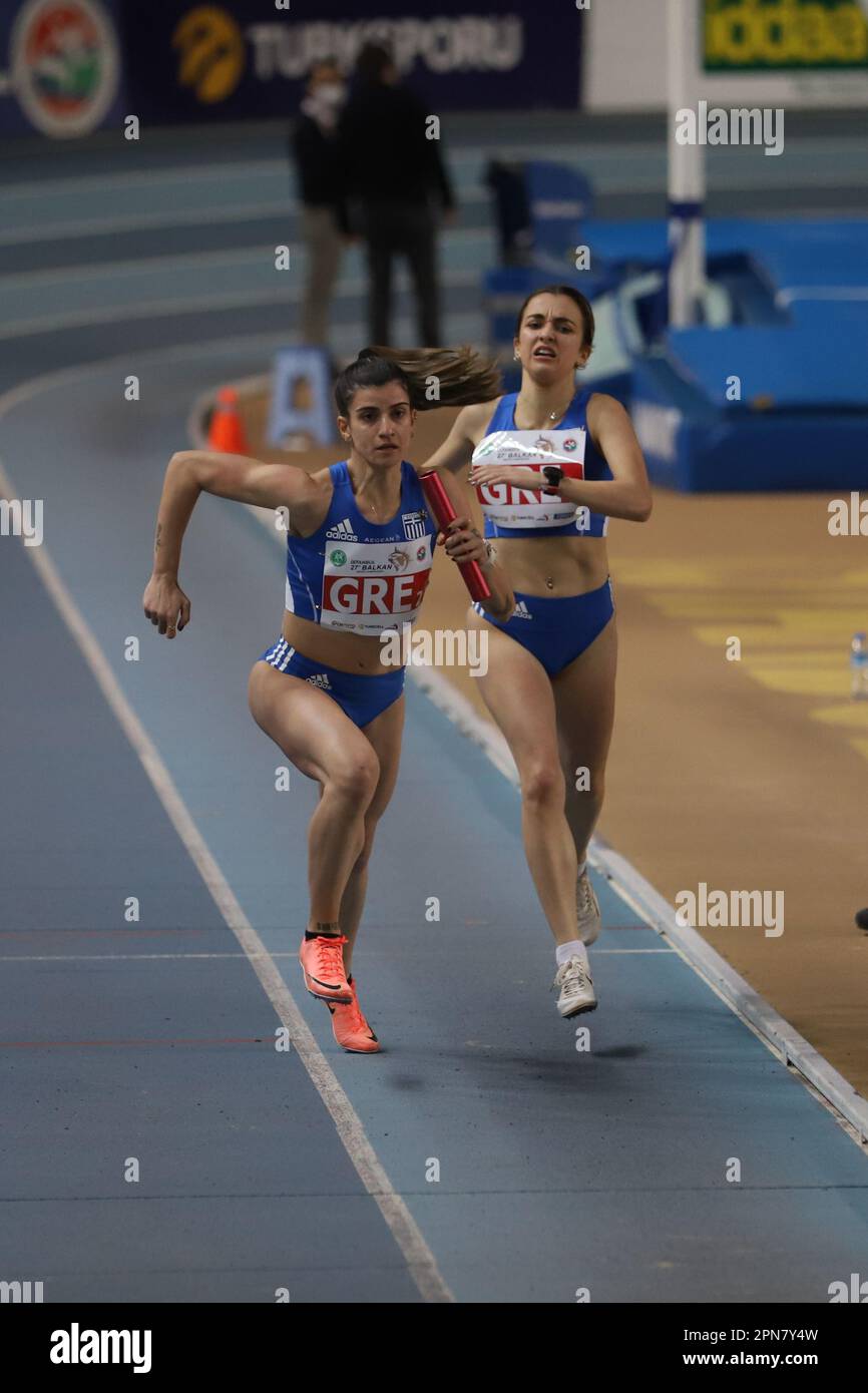 ISTANBUL, TURKEY - MARCH 05, 2022: Athletes running 4x400 metres relay ...