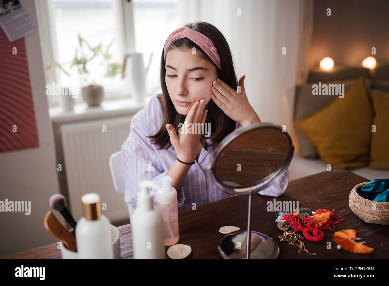 Teenage girl doing her skin care routine Stock Photo - Alamy