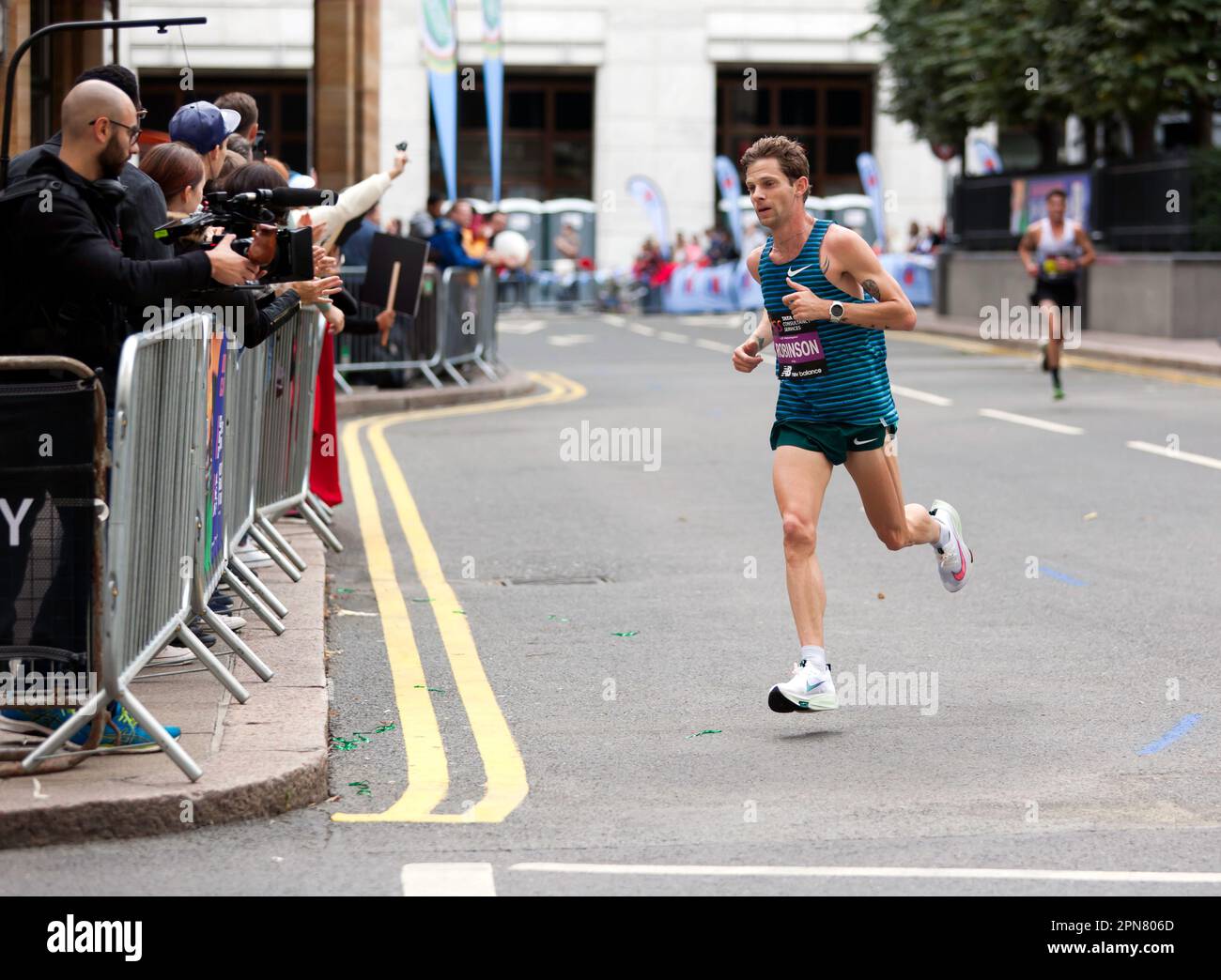 Brett Robinson (AUS), passing through Cabot Square during the Elite men ...